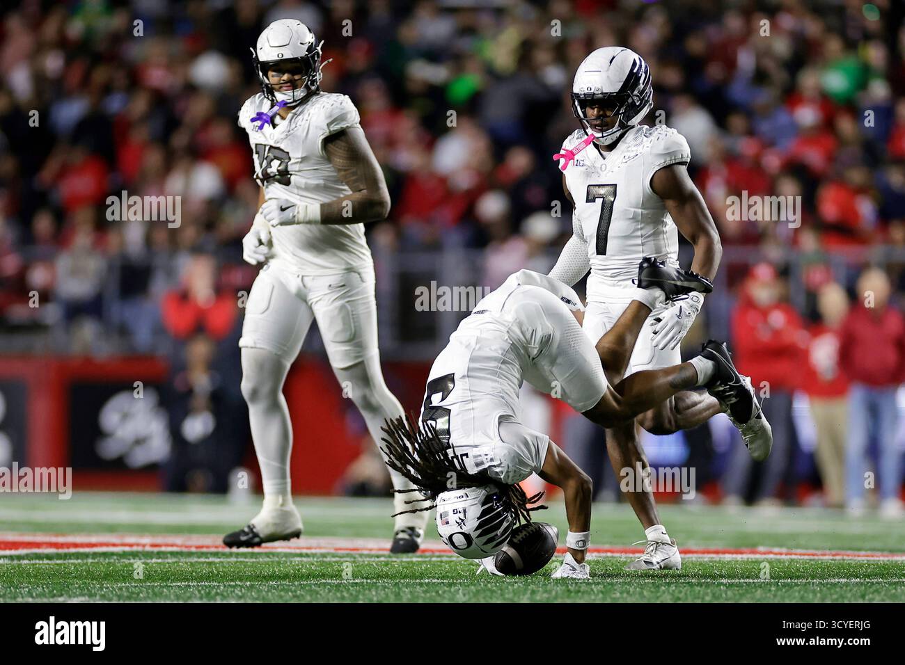 Oregon defensive back Theran Johnson (5) tumbles after recovering a ...