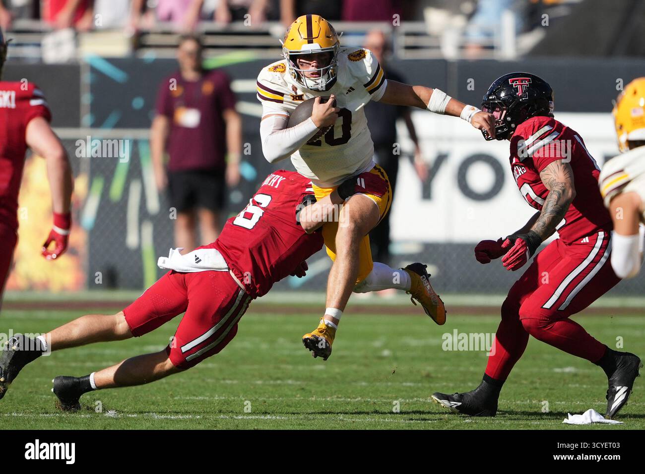 Arizona State quarterback Sam Leavitt (10) leaps over Texas Tech ...
