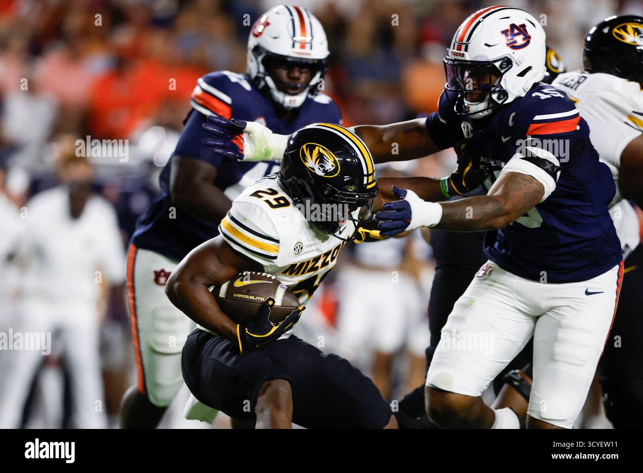 Missouri running back Ahmad Hardy (29) is tackled for a loss by Auburn ...