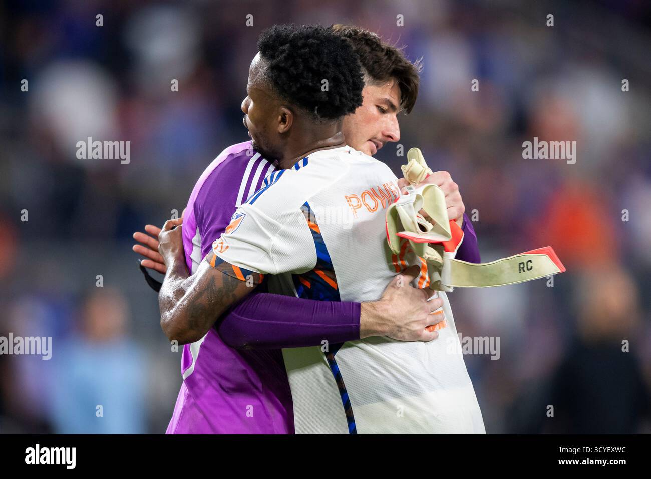 FC Cincinnati defender Alvas Powell and goalkeeper Roman Celentano hug ...