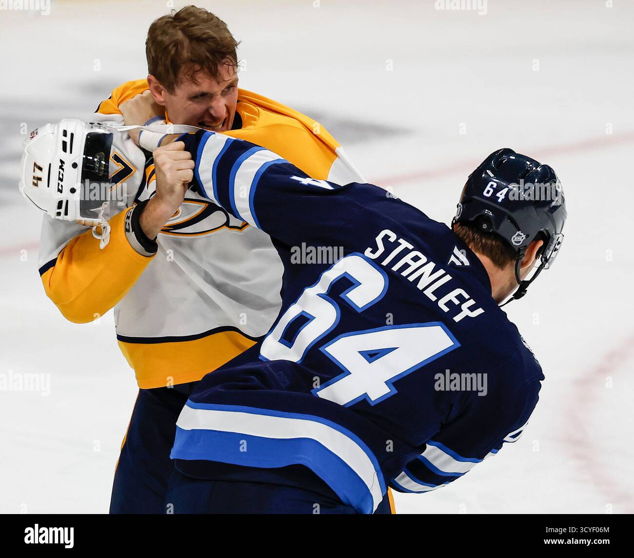Winnipeg Jets' Logan Stanley (64) and Nashville Predators' Michael ...