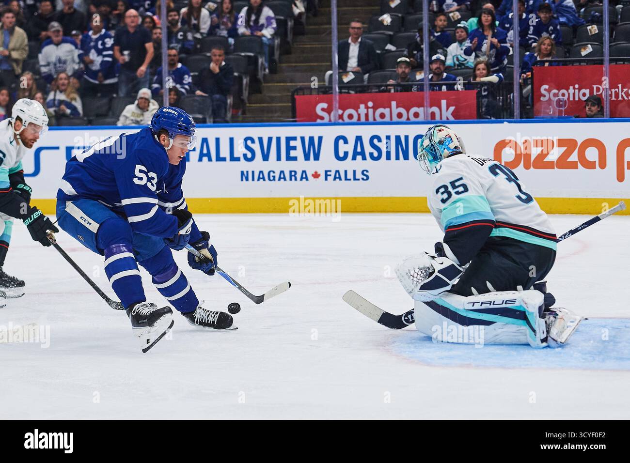 Toronto Maple Leafs' Easton Cowan (53) loses control of the puck in ...