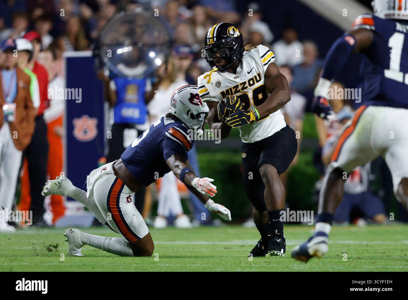 Missouri running back Ahmad Hardy, center right, caries the ball as ...