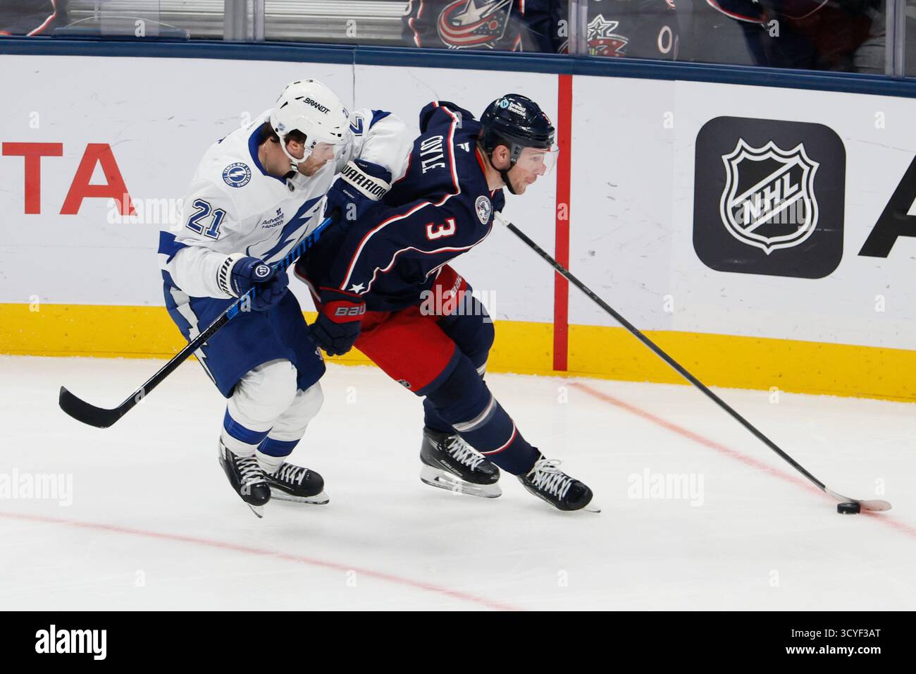Columbus Blue Jackets' Charlie Coyle, right, controls the puck as Tampa ...