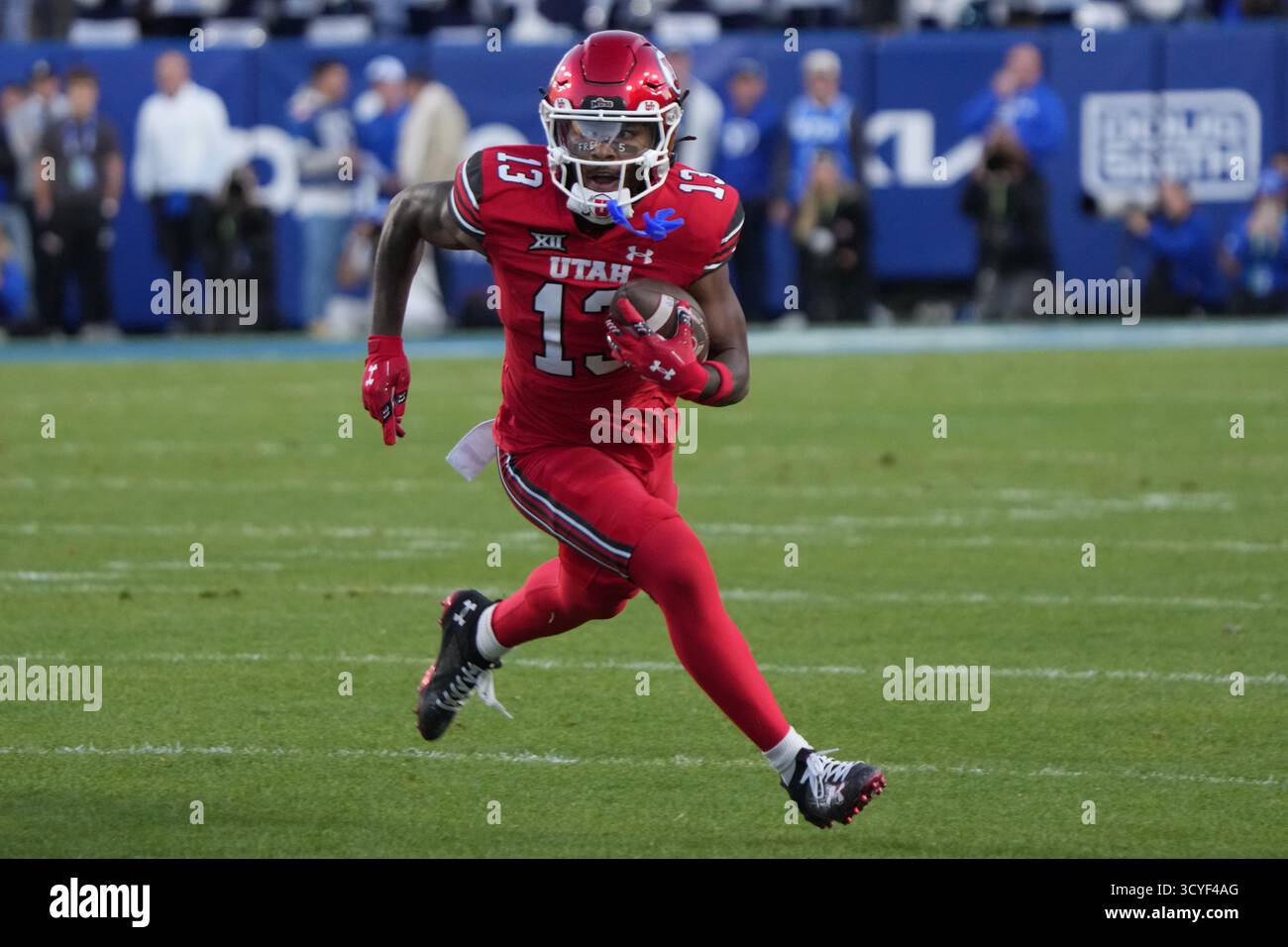 Utah running back Daniel Bray (13) runs the ball during the first half ...
