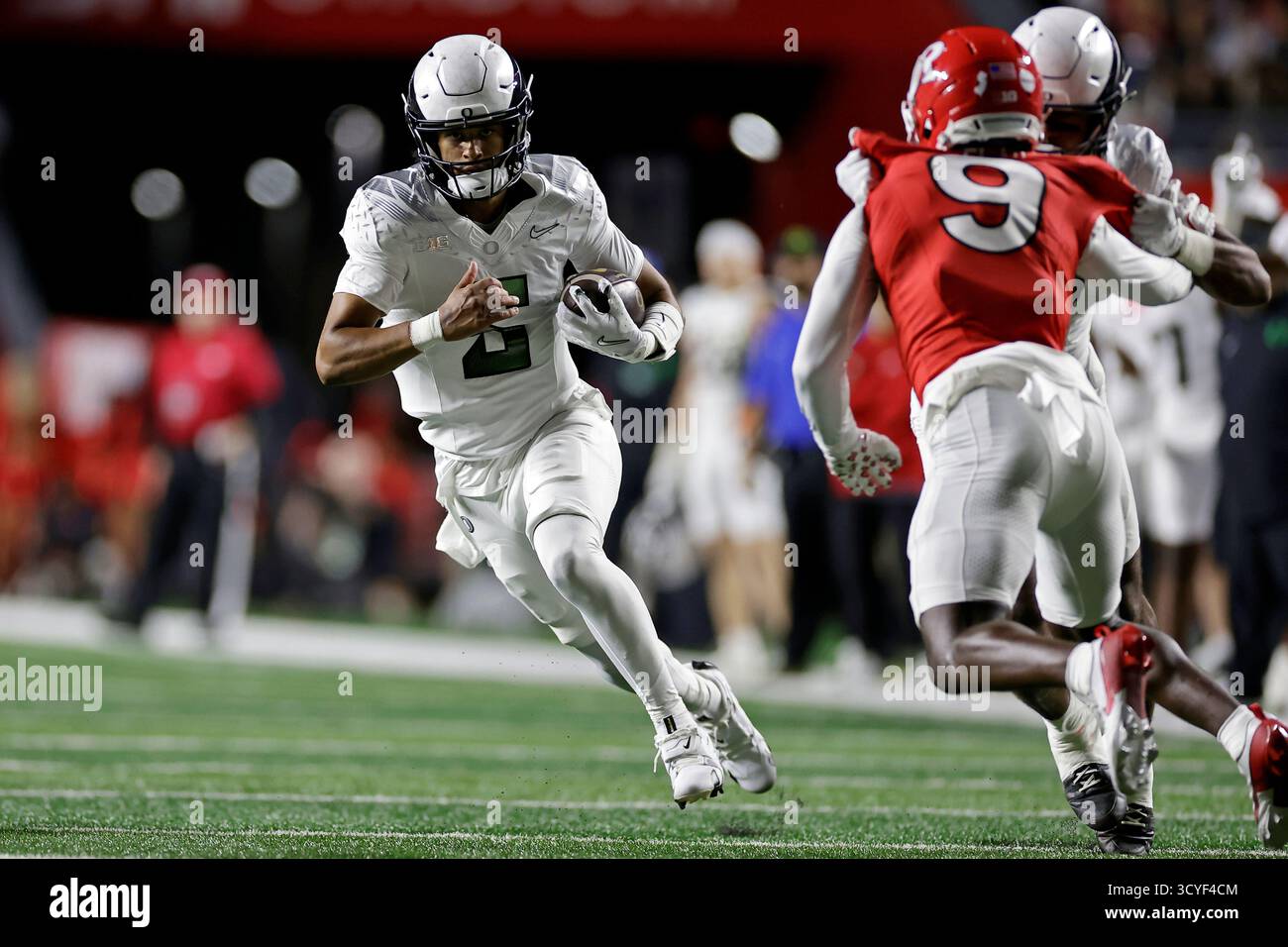 Oregon quarterback Dante Moore (5) runs with the ball during the first ...