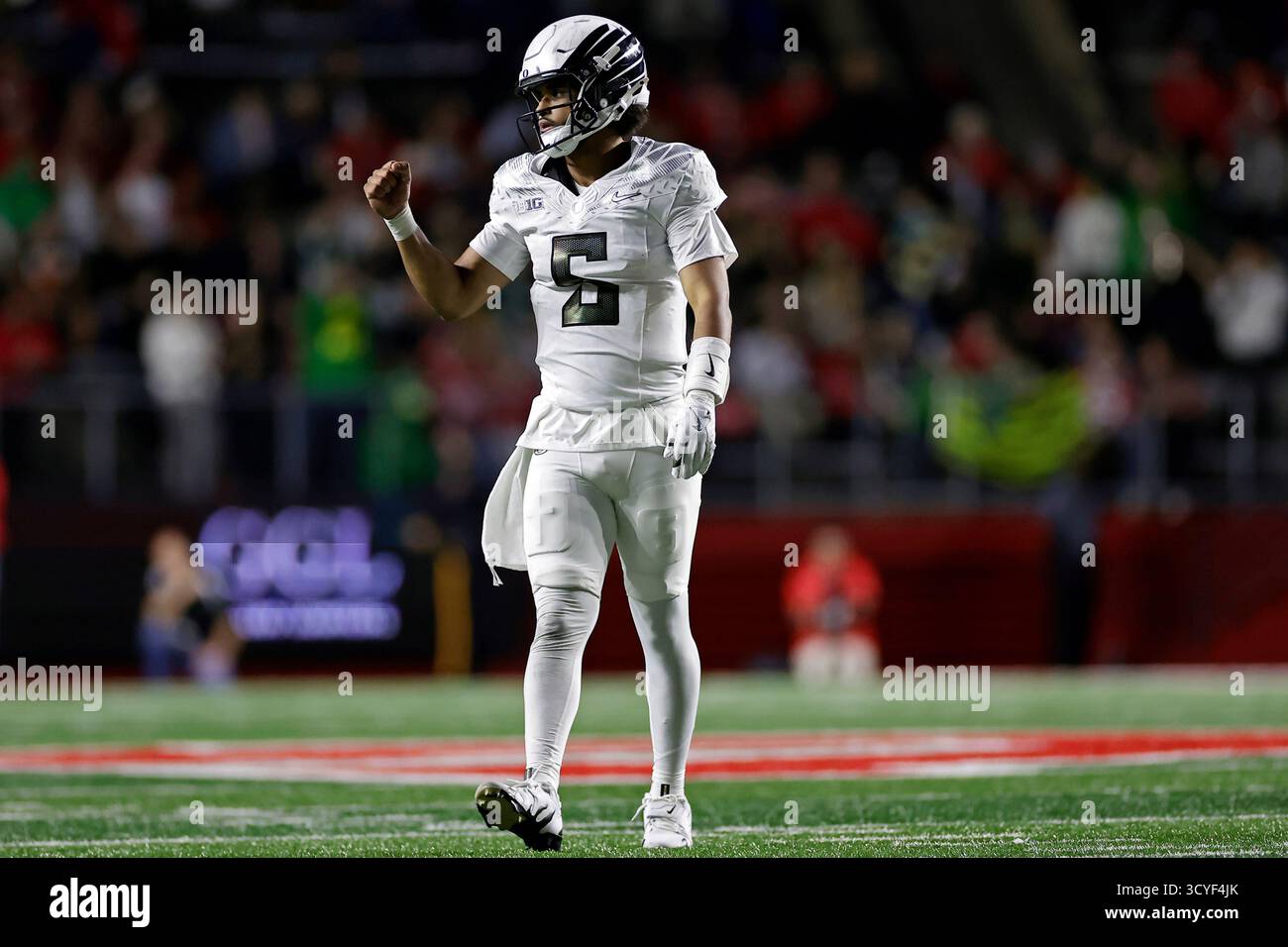Oregon quarterback Dante Moore (5) reacts after a touchdown during the ...