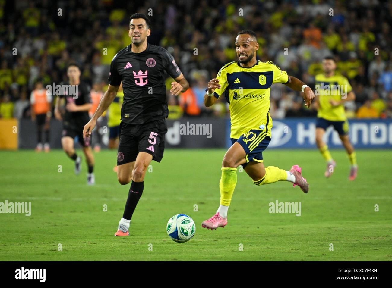 Nashville SC midfielder Hany Mukhtar (10) moves the ball upfield as Inter Miami midfielder ...