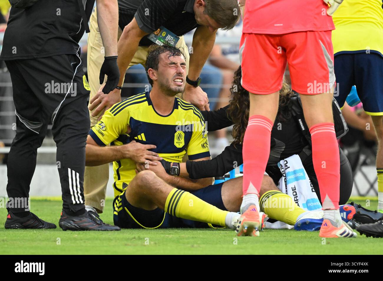 Nashville SC defender Jack Maher (5) is tended to in a MLS soccer match ...