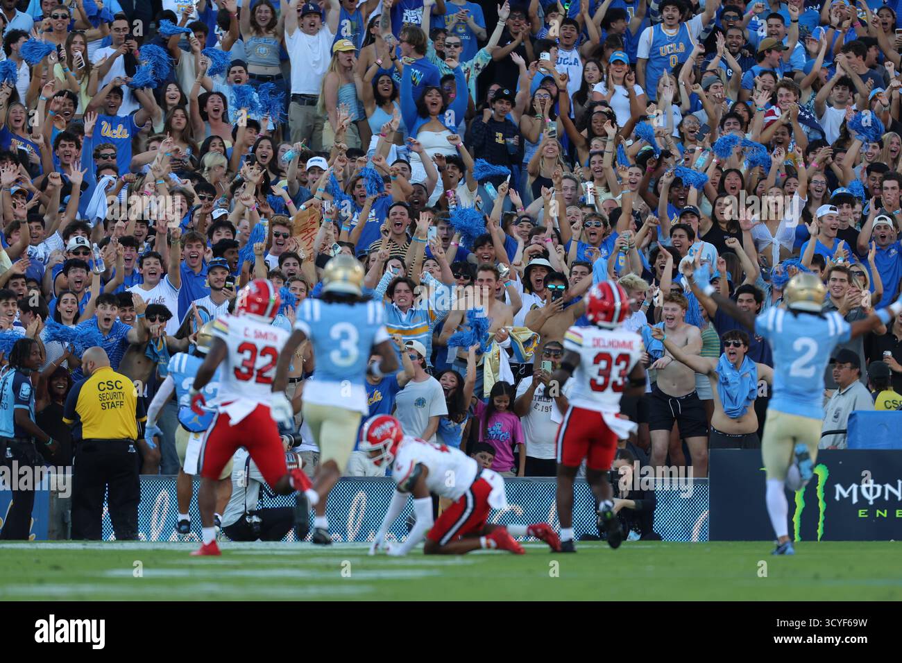 PASADENA, CA - OCTOBER 18: UCLA Bruins' fans celebrate a touchdown by ...