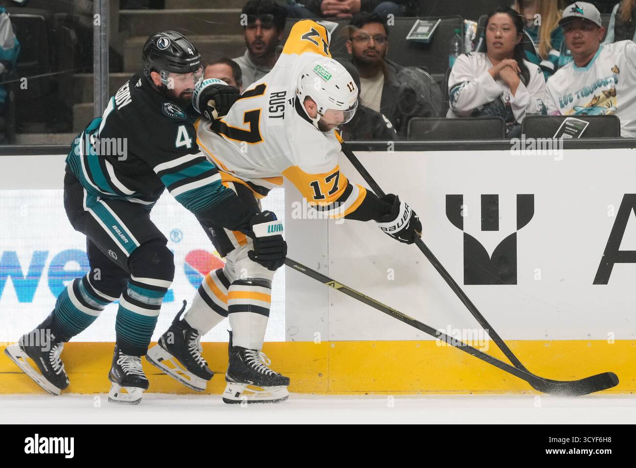 Pittsburgh Penguins right wing Bryan Rust (17) reaches for the puck ...