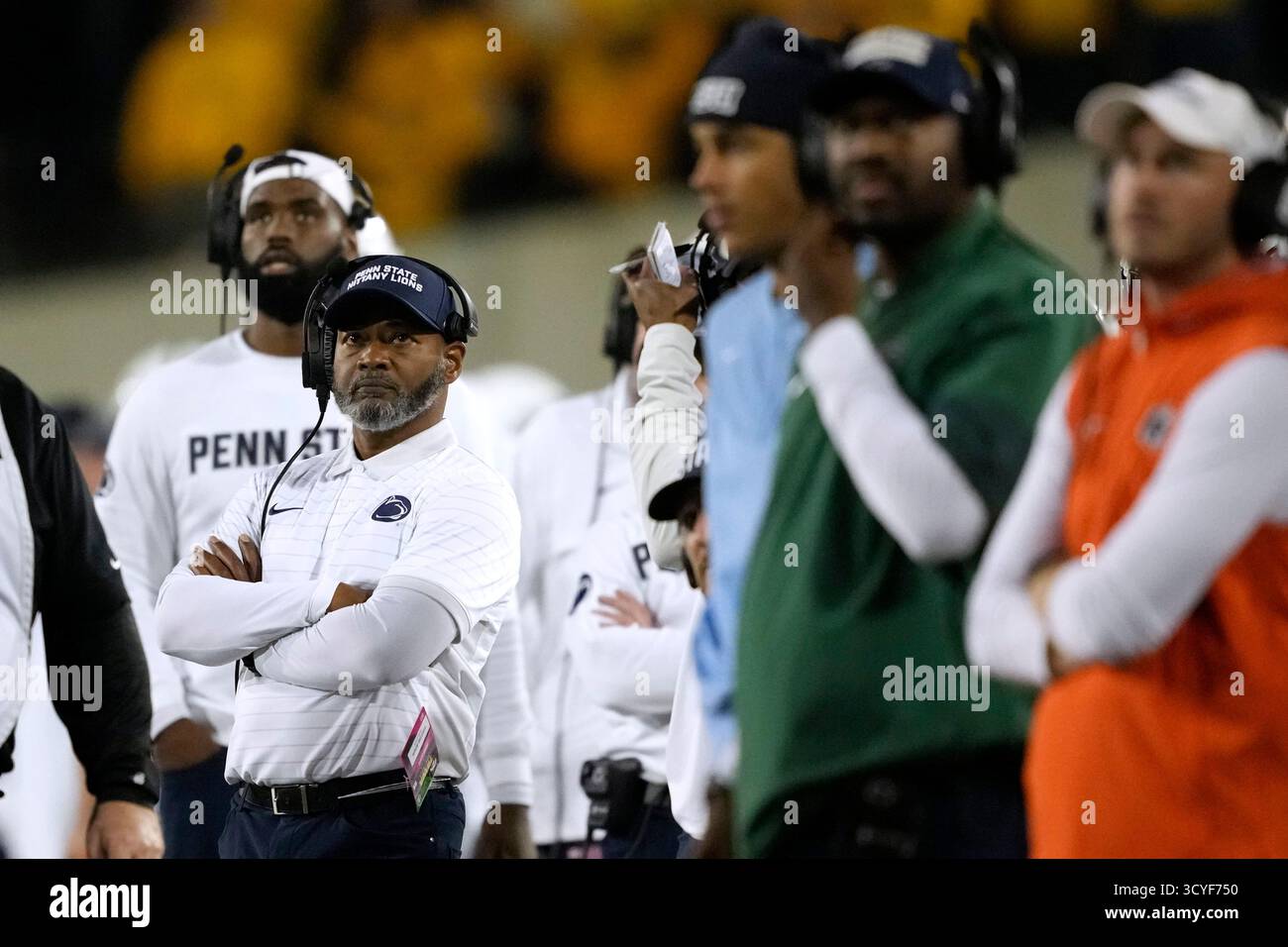 Penn State interim head coach Terry Smith, left, watches from the ...