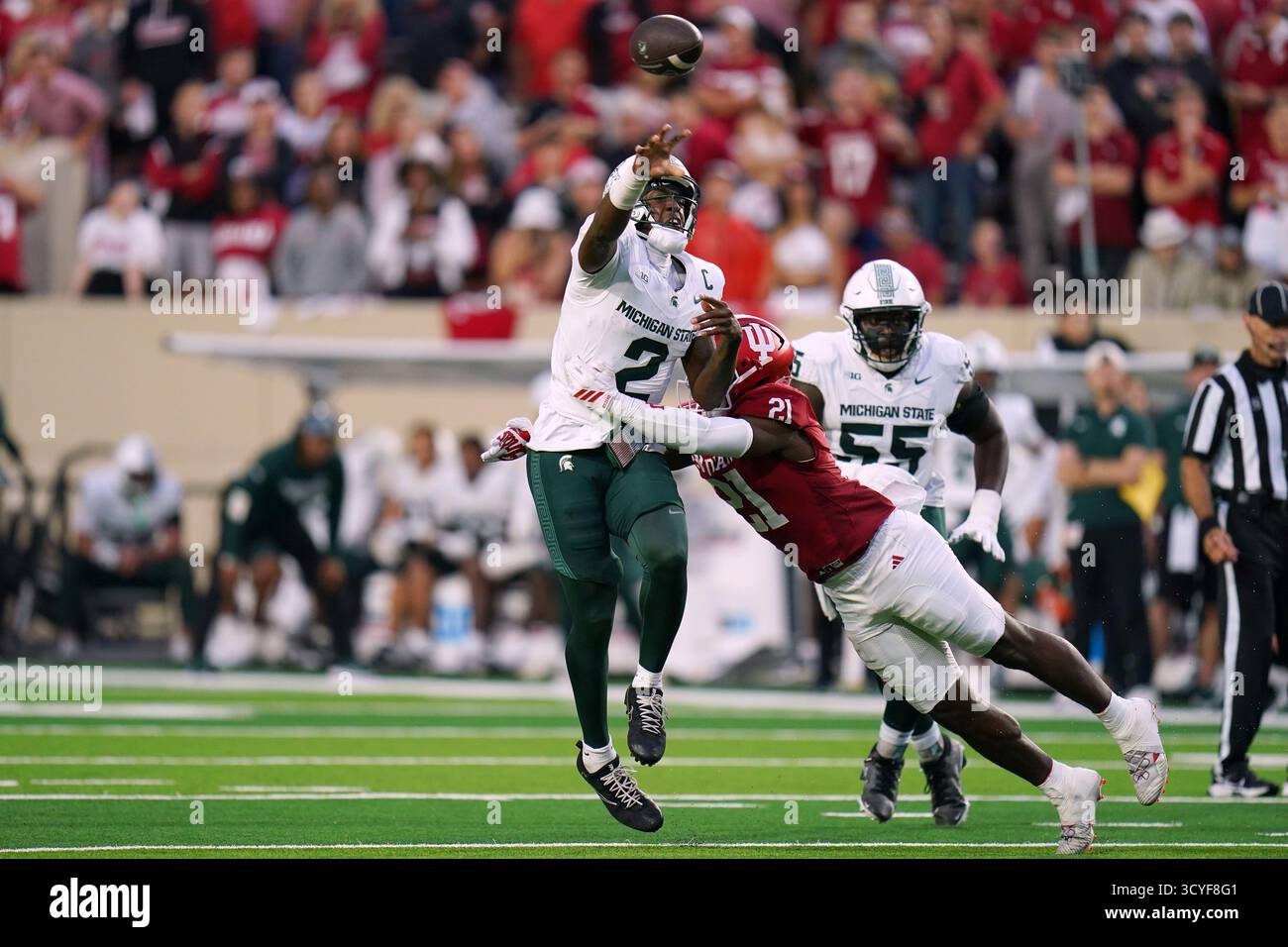 Michigan State quarterback Aidan Chiles passes the ball while being ...