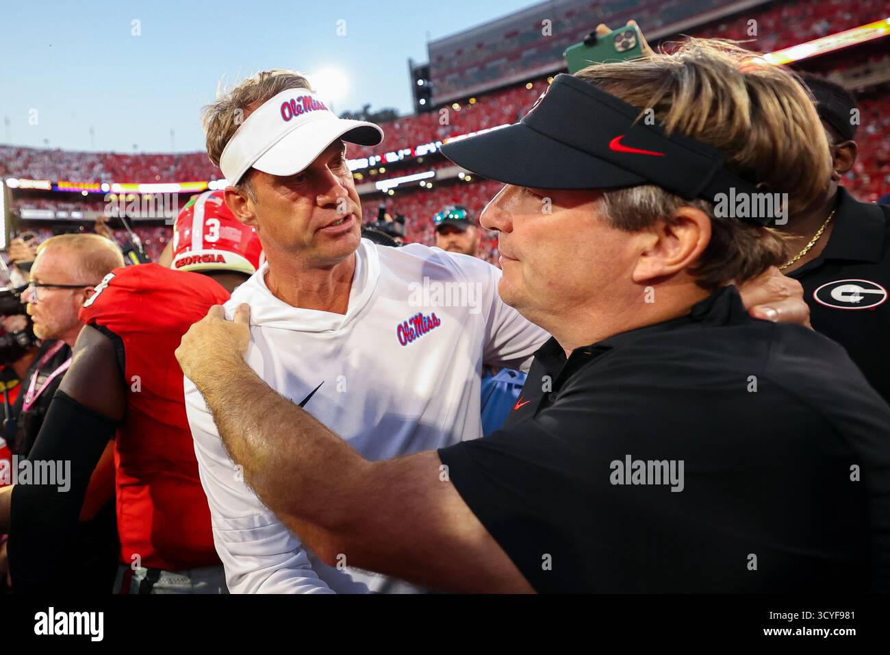 Mississippi head coach Lane Kiffin, left, and Georgia head coach Kirby ...