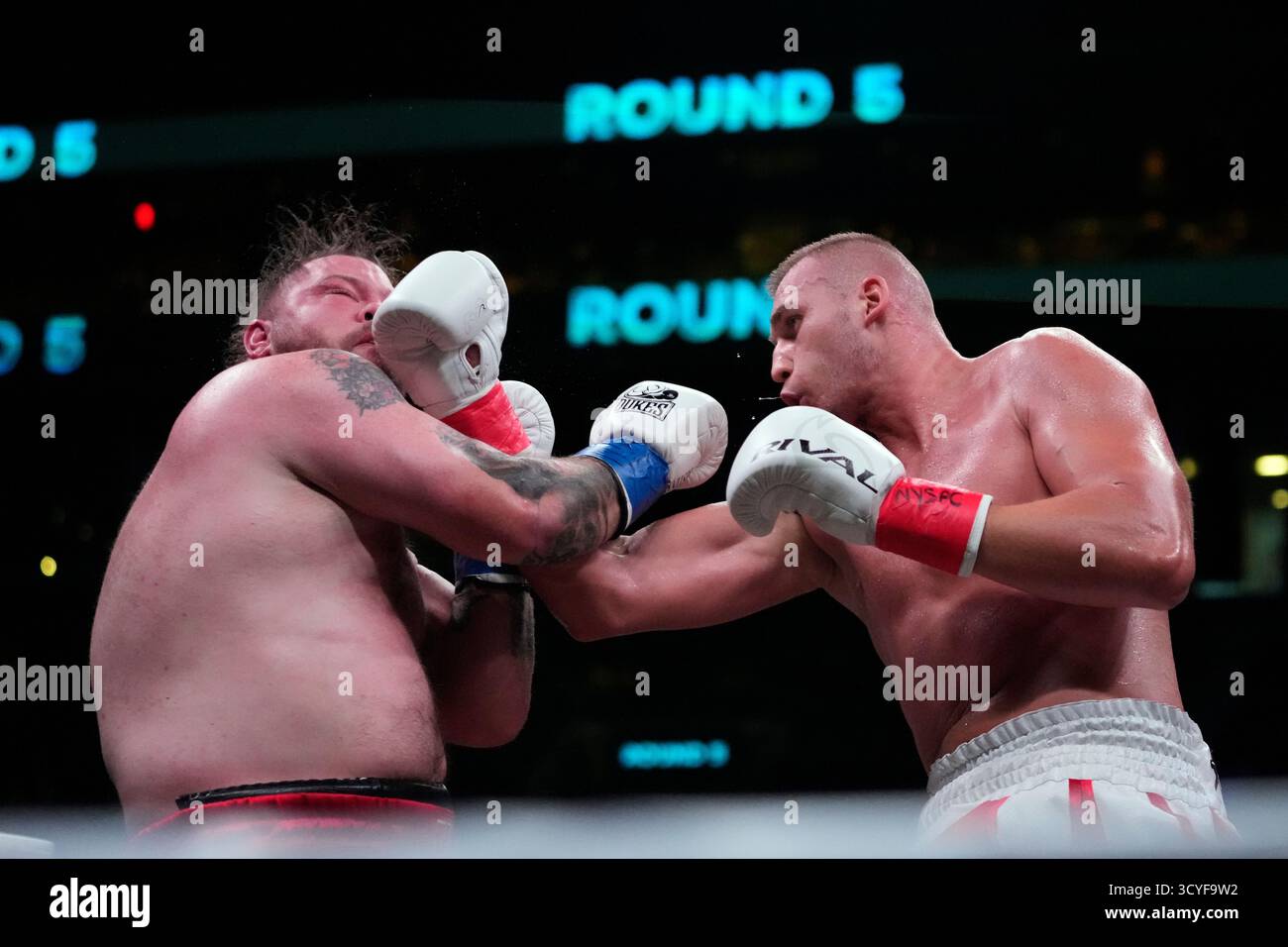 Poland's Damian Knyba, right, punches Joey Dawejko during the fifth ...