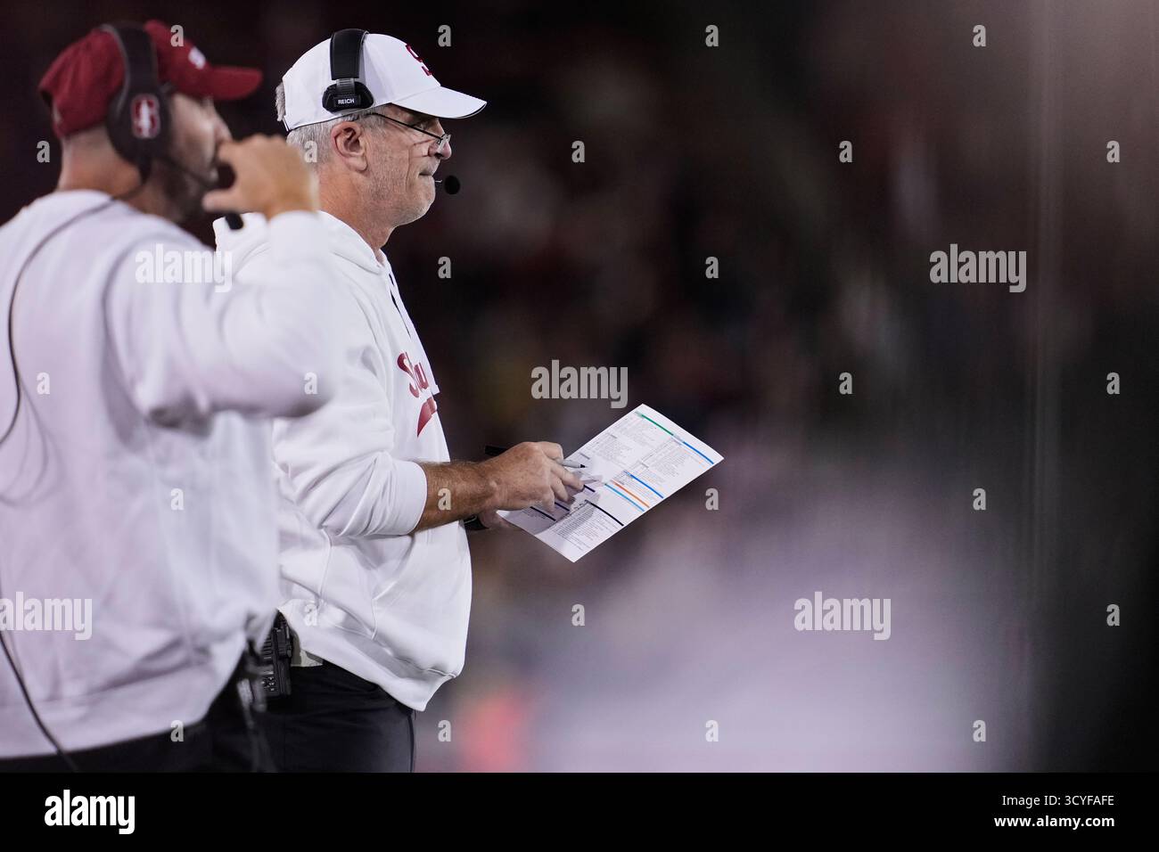 Stanford head coach Frank Reich, right, watches from the sideline ...