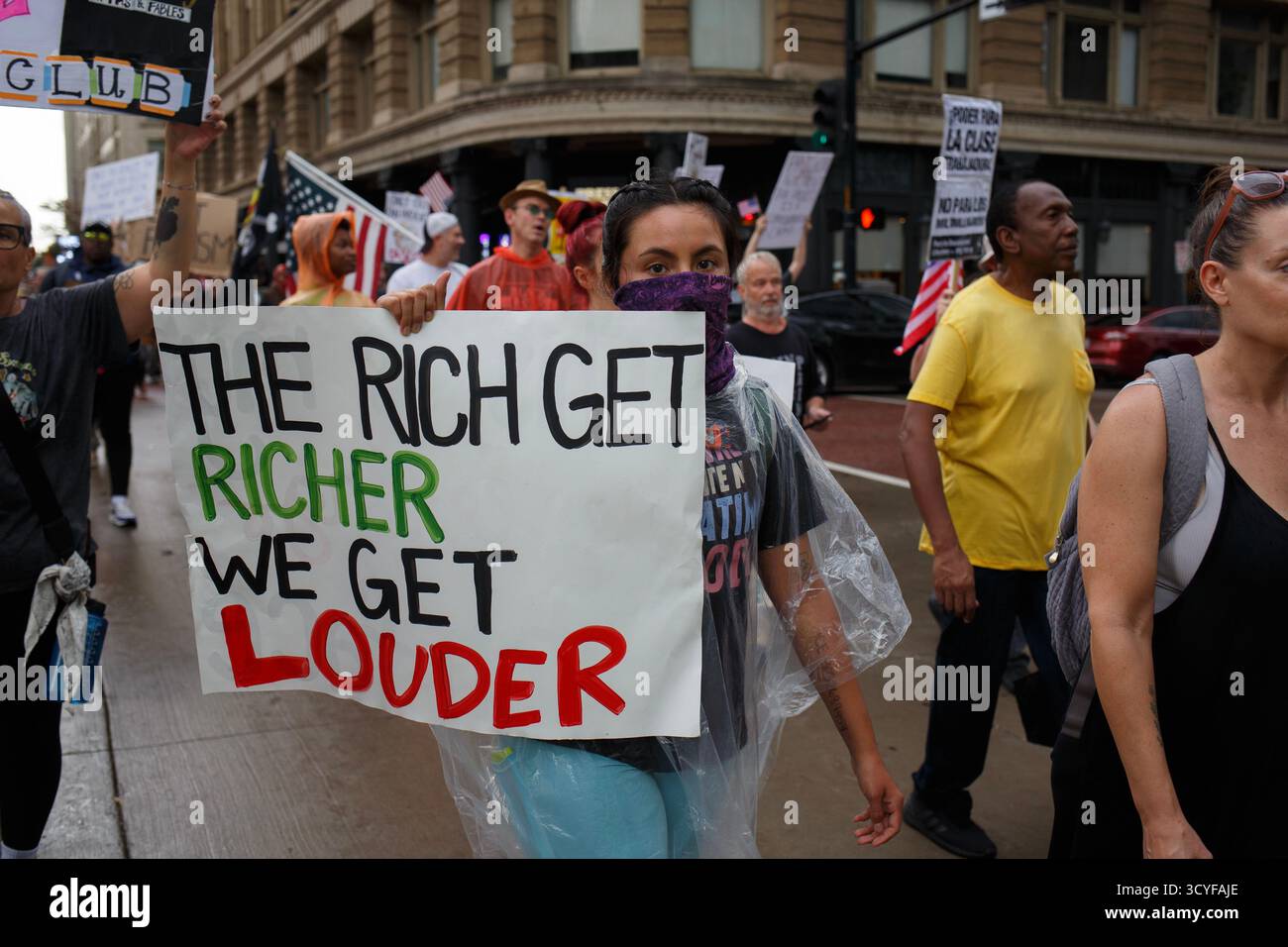 Dallas, Texas, USA. 18th Oct, 2025. A woman marches down Elm Street ...