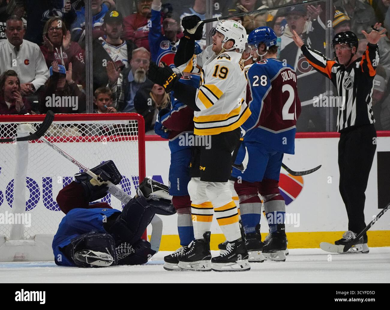 Boston Bruins center John Beecher, right, reacts after his shot was ...