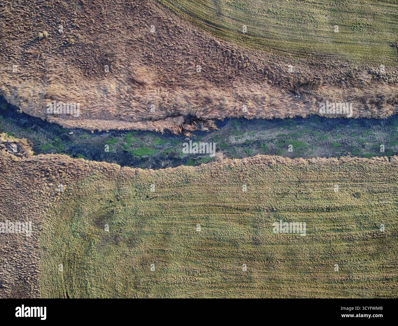 River running through field grass hi-res stock photography and images ...