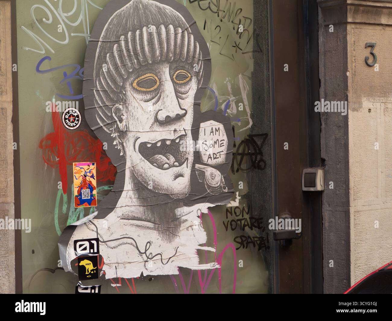 Pisa, Italy - October 16th 2025 Street art paste up showing a stylized ...
