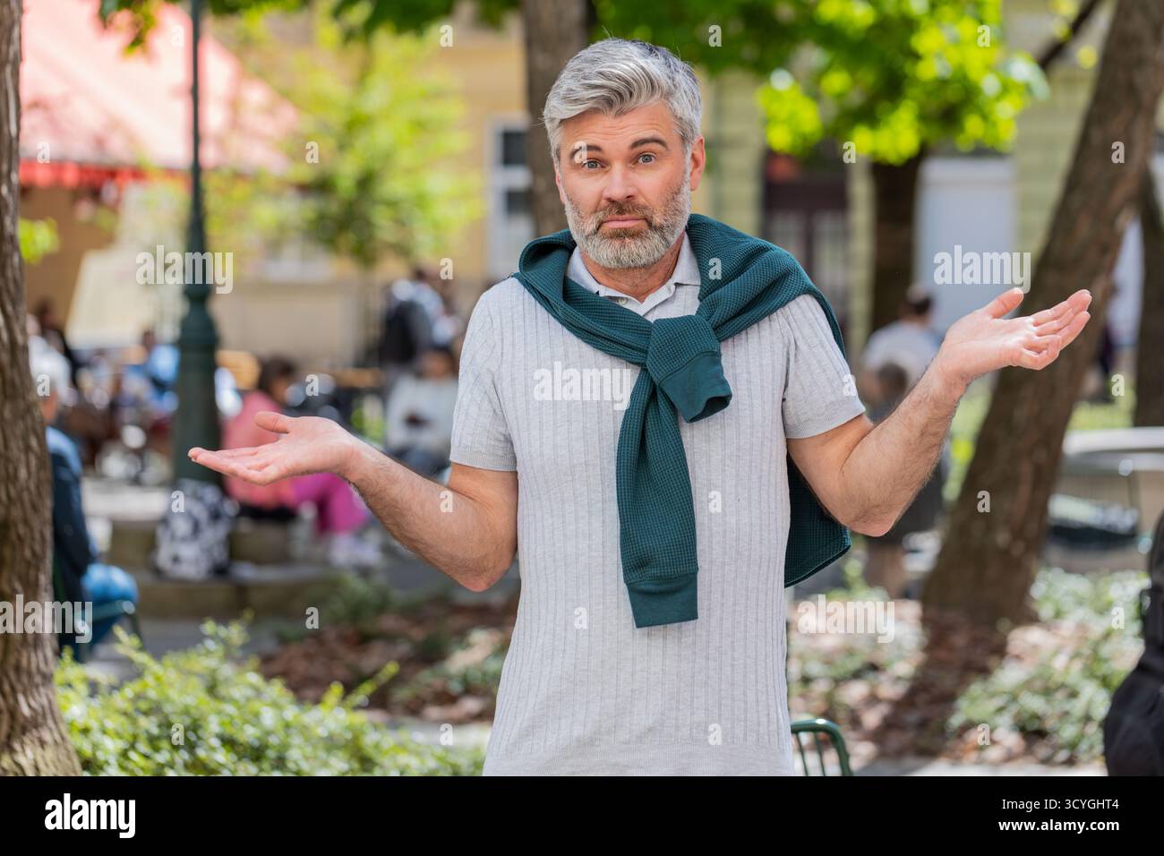 I don't know what to say. Confused mature man feeling embarrassed about ...