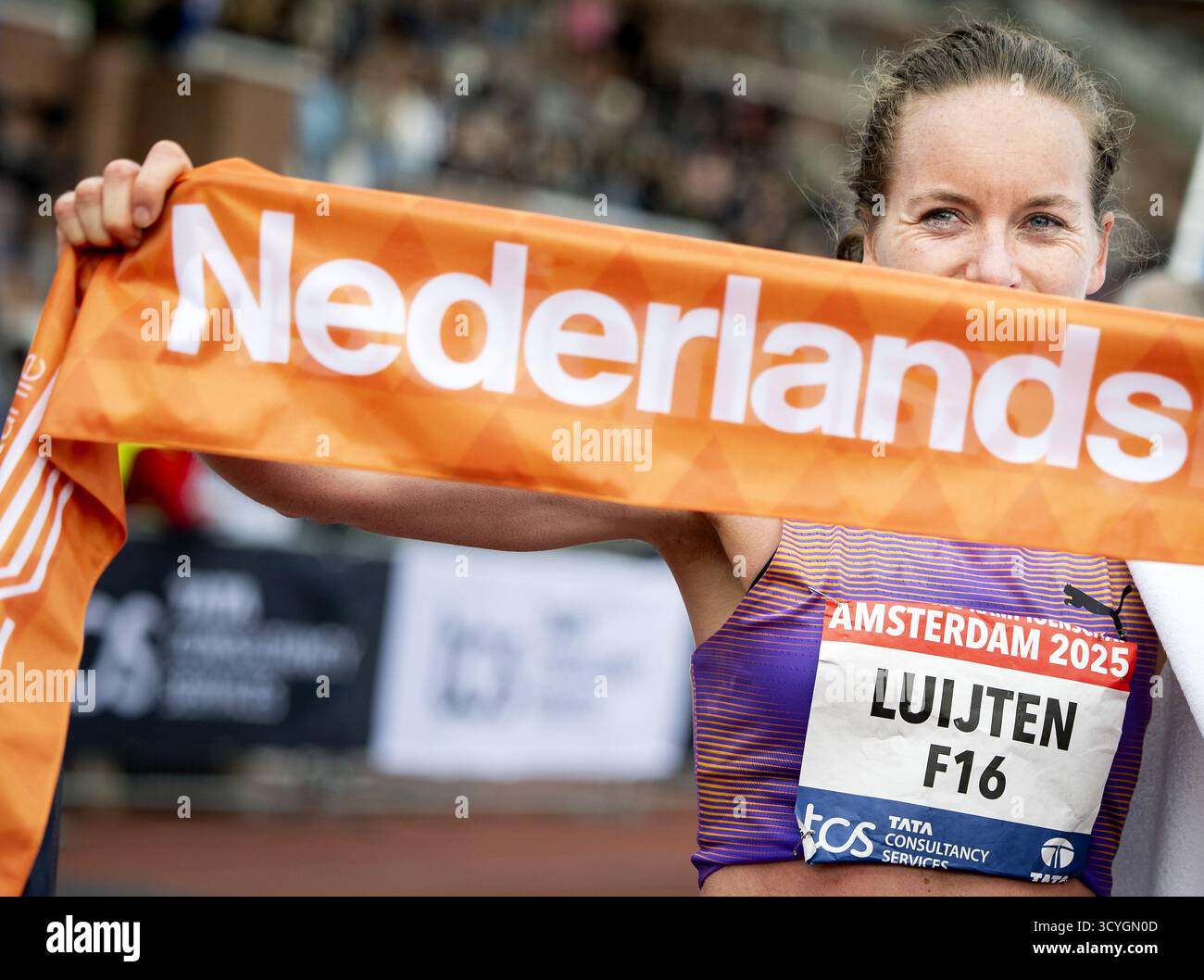 AMSTERDAM – Anne Luijten crosses the finish line of the 50th edition of ...
