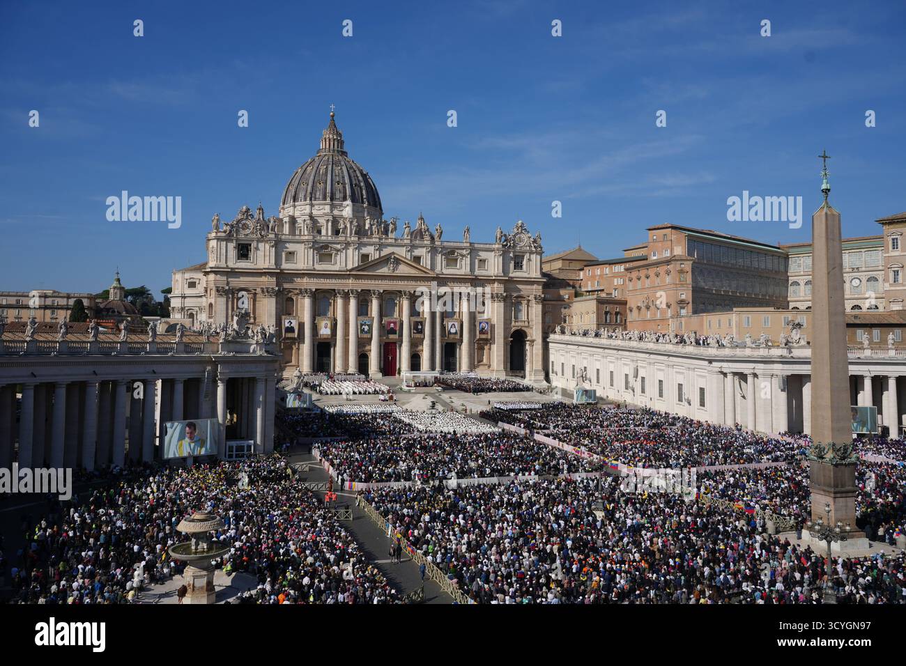 Tapestries depicting seven new Catholic saints hang from the facade of ...