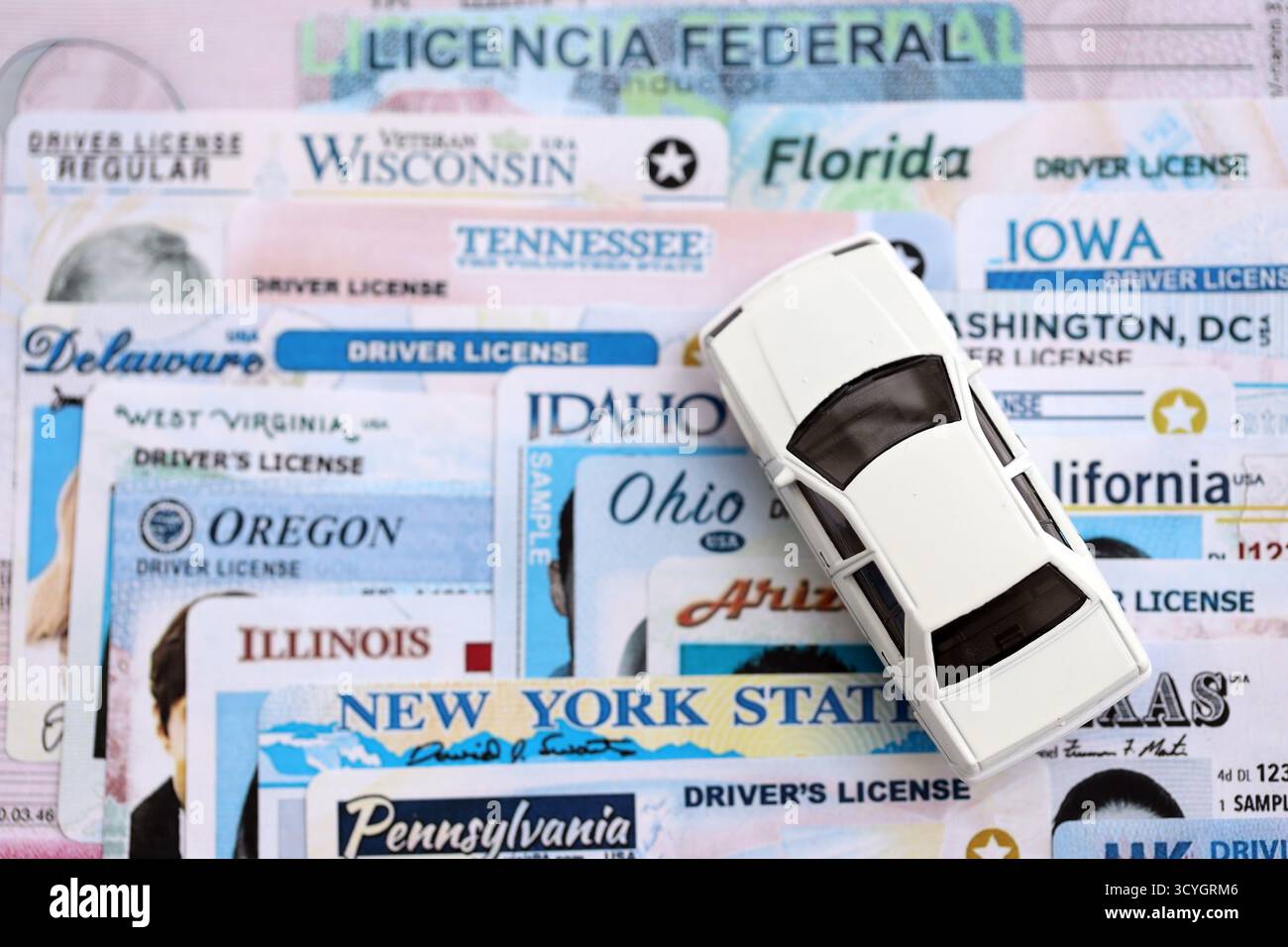 Toy car on big amount of driving licenses from different USA states ...