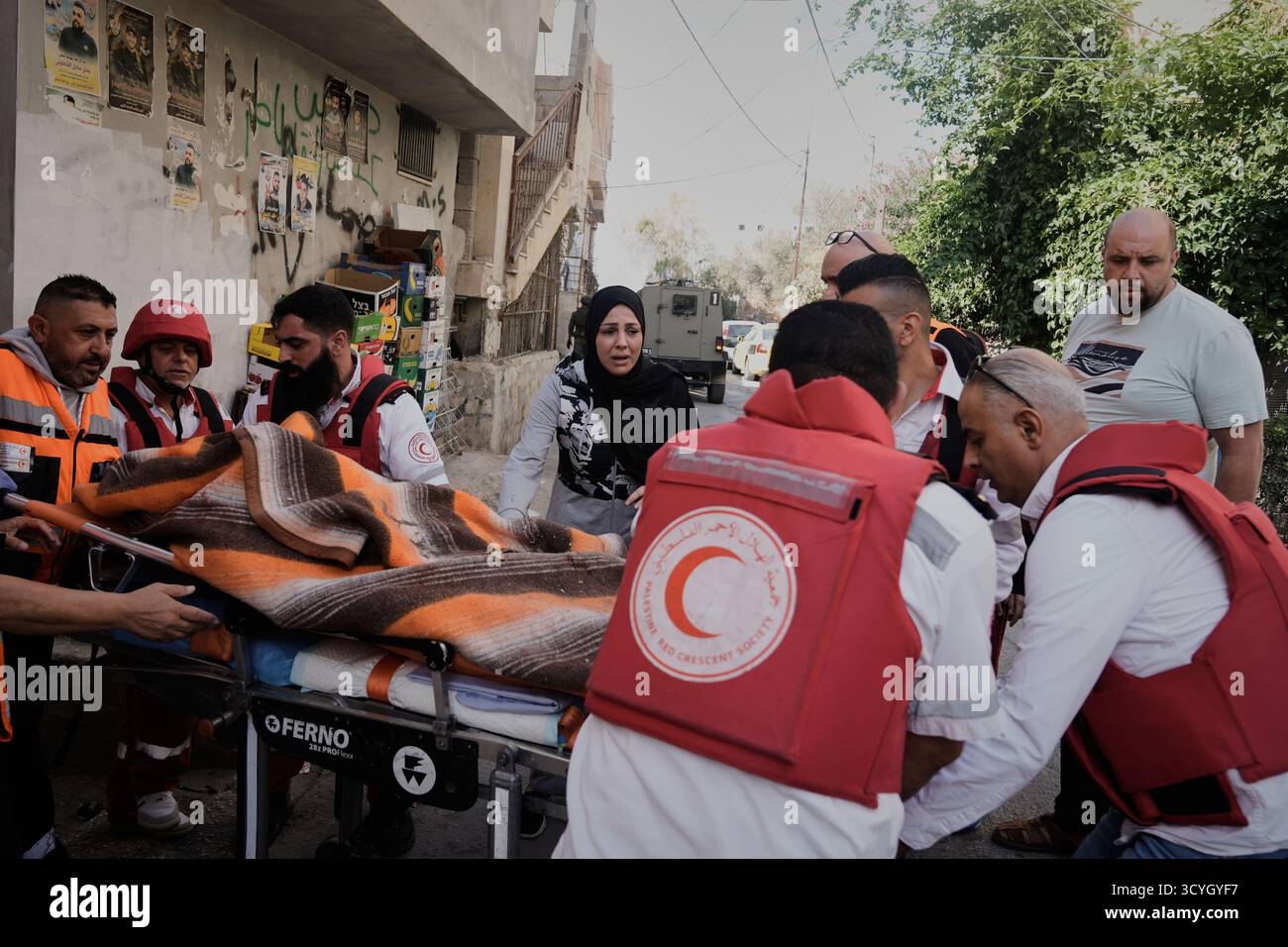 Palestinian Red Crescent paramedics carry the body of Majid Daoud, 42 ...