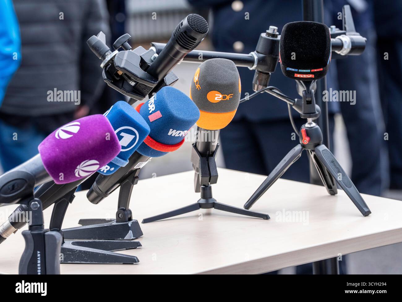 Microphones from various radio stations and television stations are set ...