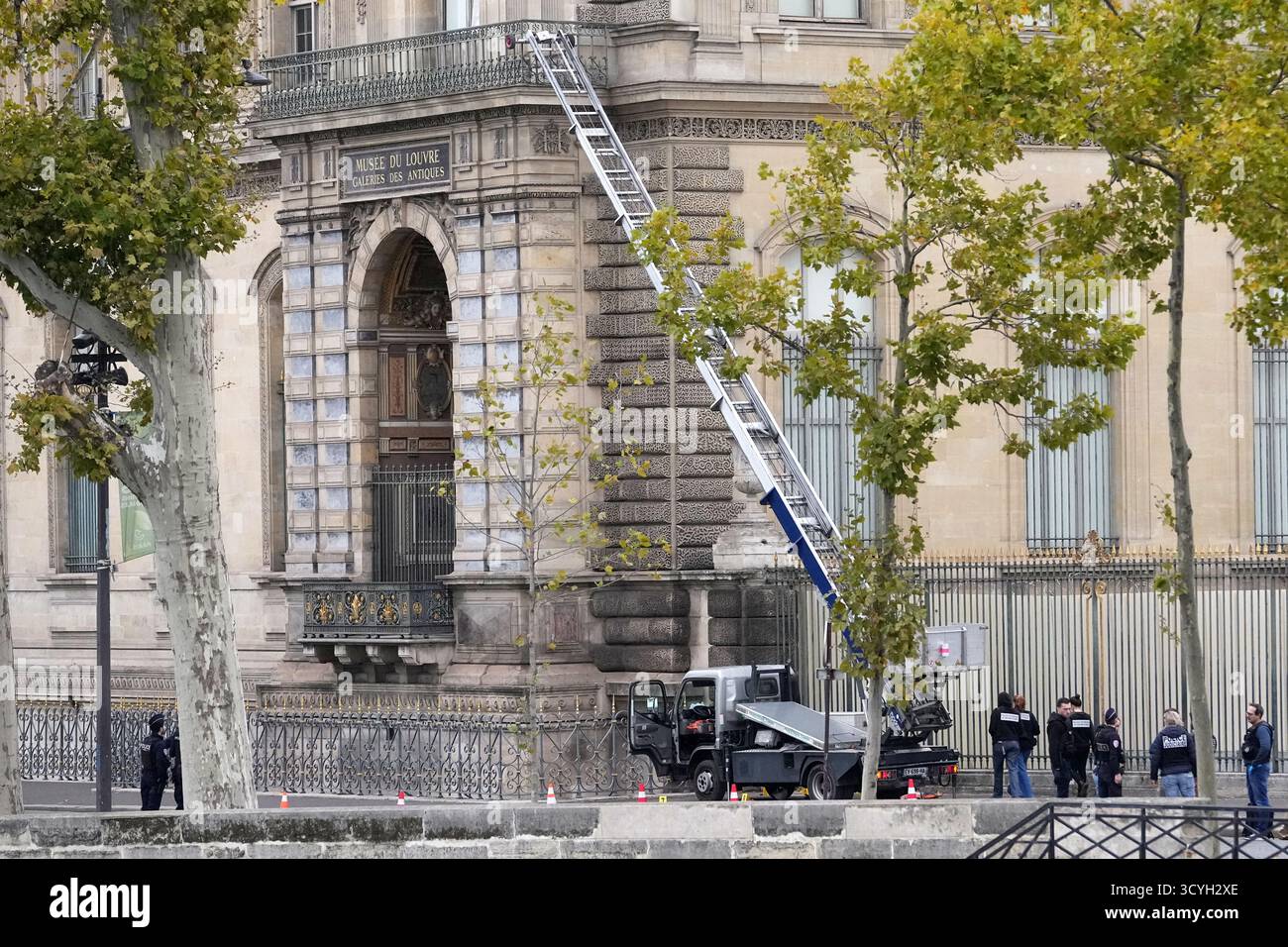 Police officers work by a basket lift used by thieves Sunday, Oct. 19 ...