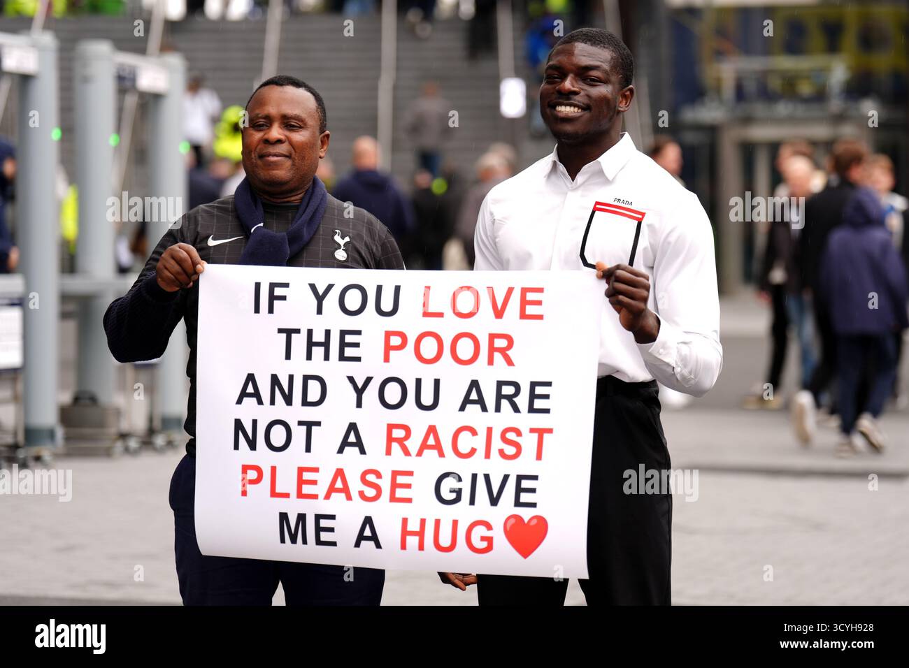 A Tottenham Hotspur fan holds up a sign ahead of the Premier League ...
