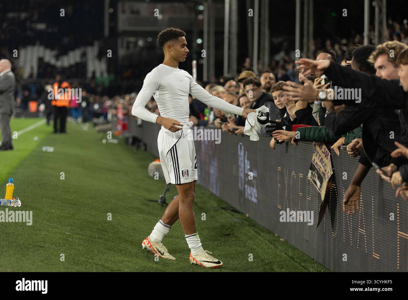 Joshua King of Fulham gives his short to a fan in the crowd during the ...