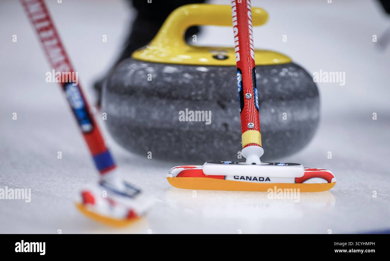 The broom of second Shannon Birchard sweeps in front of a rock from ...