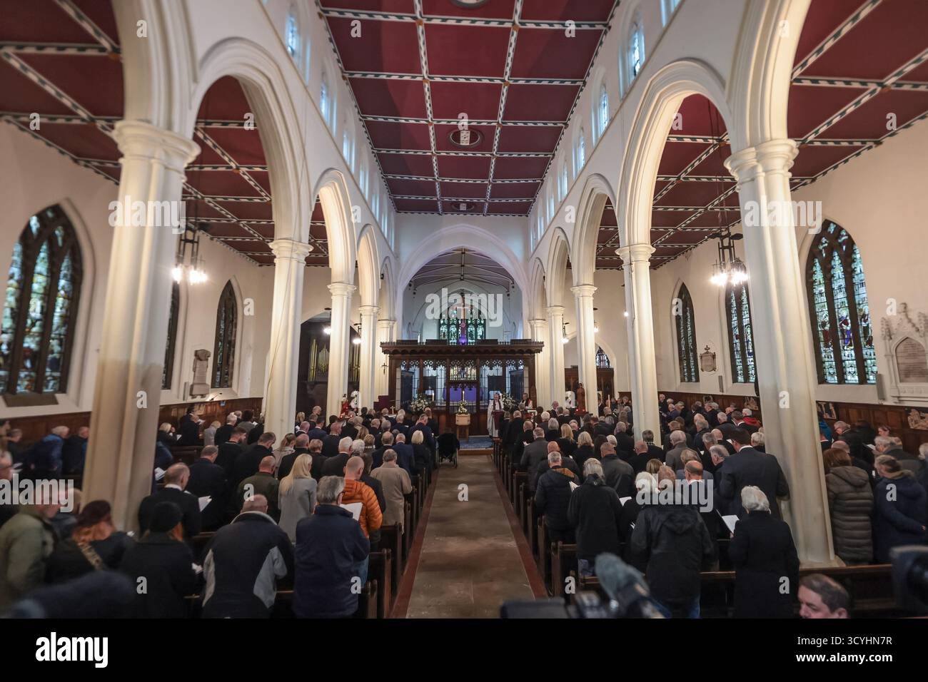 Attendee’s stand while they sing hymns during the Funeral of Harold Dennis “Dickie” Bird OBE at ...