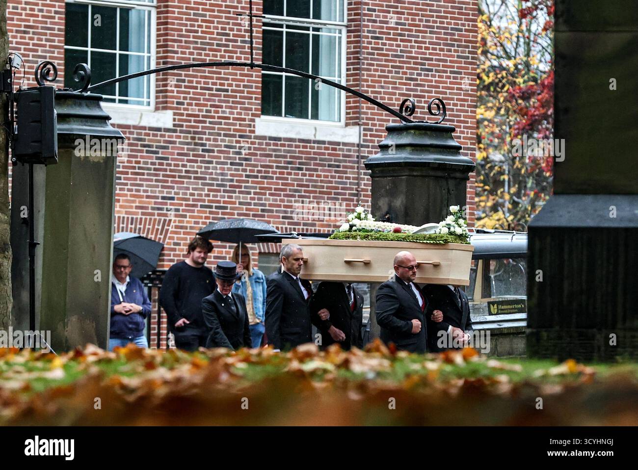 The pallbearers carry the coffin during the Funeral of Harold Dennis ...