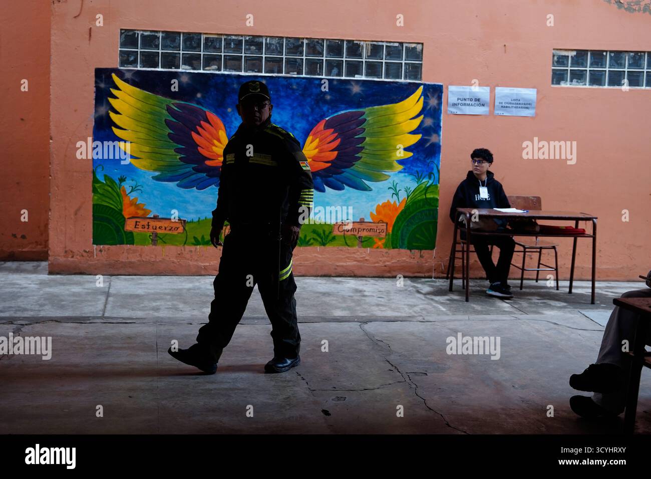 A police officer guards a polling station during a presidential runoff ...