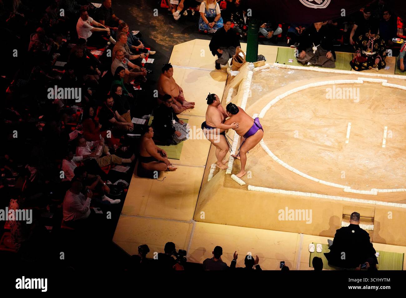 Takerufuji battles with Churanoumi in the Makuuchi Division bout on day ...