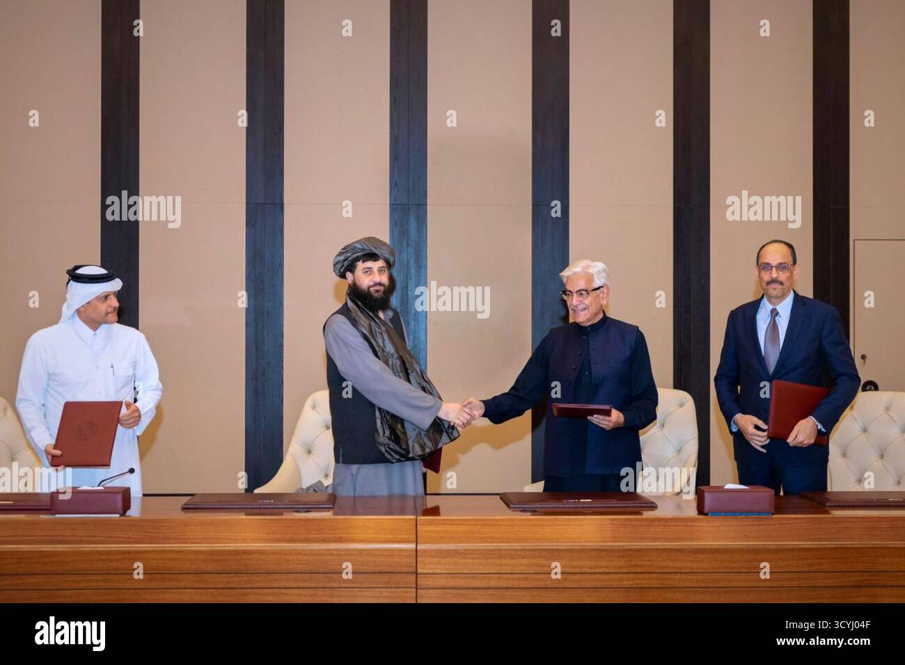Pakistani Defence Minister Khawaja Asif, center right, and Afghan ...