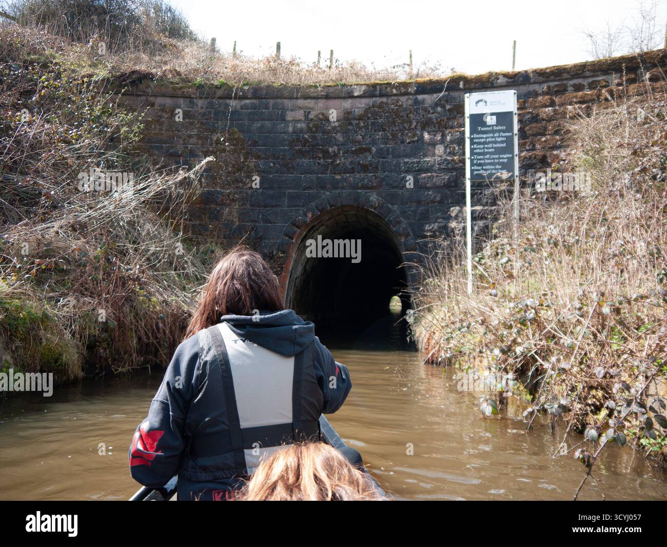 Narrowboat entering Leek Tunnel on the Caldon Canal, Staffordshire ...