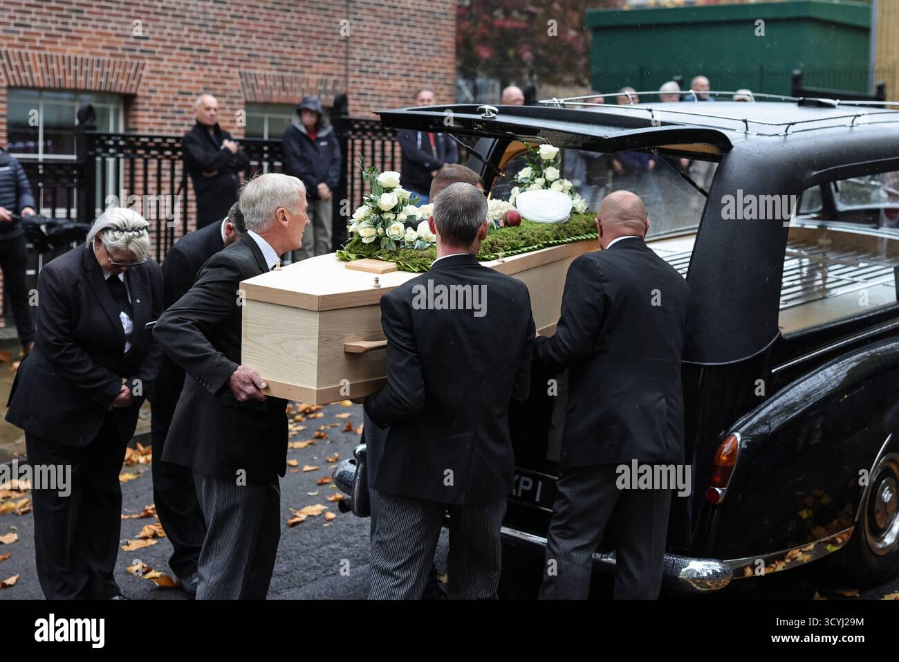 Harold Dennis “Dickie” Bird OBE coffin is placed into the hearse during ...