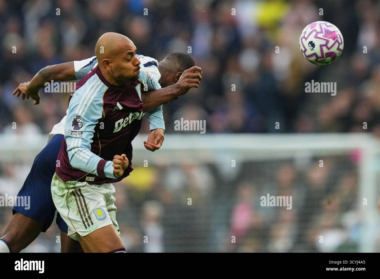 Aston Villa's Donyell Malen vies for the ball with Tottenham's Djed ...