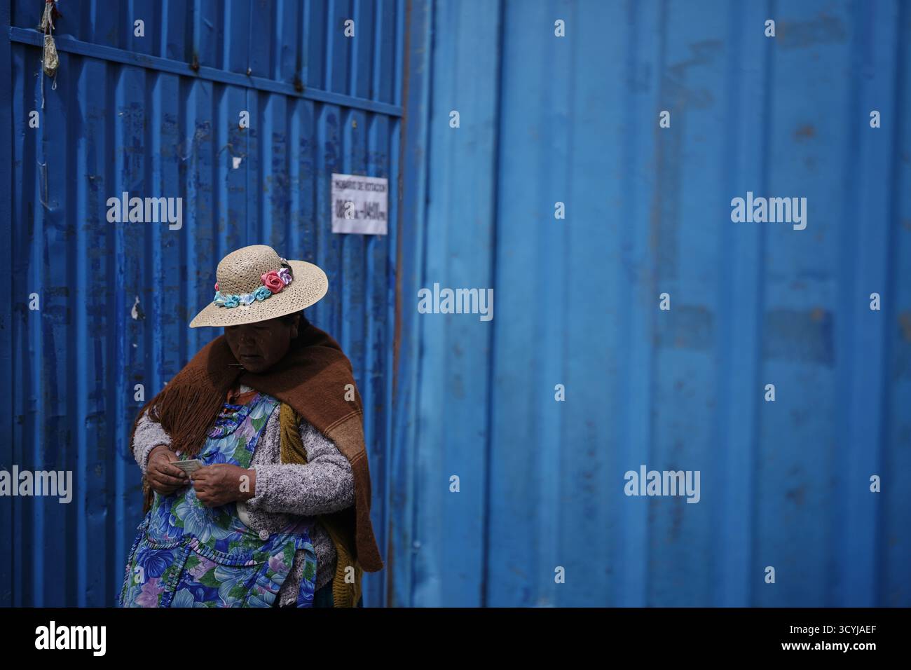 A woman leaves a polling station after voting in a presidential runoff ...