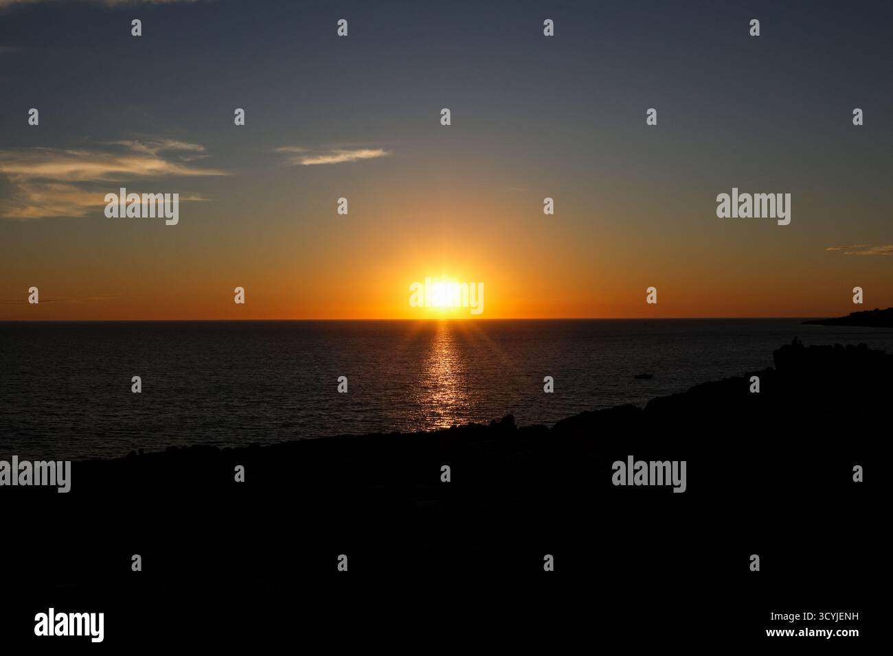 A photo of sun set over the Atlantic ocean, taken at Boca Do Inferno ...