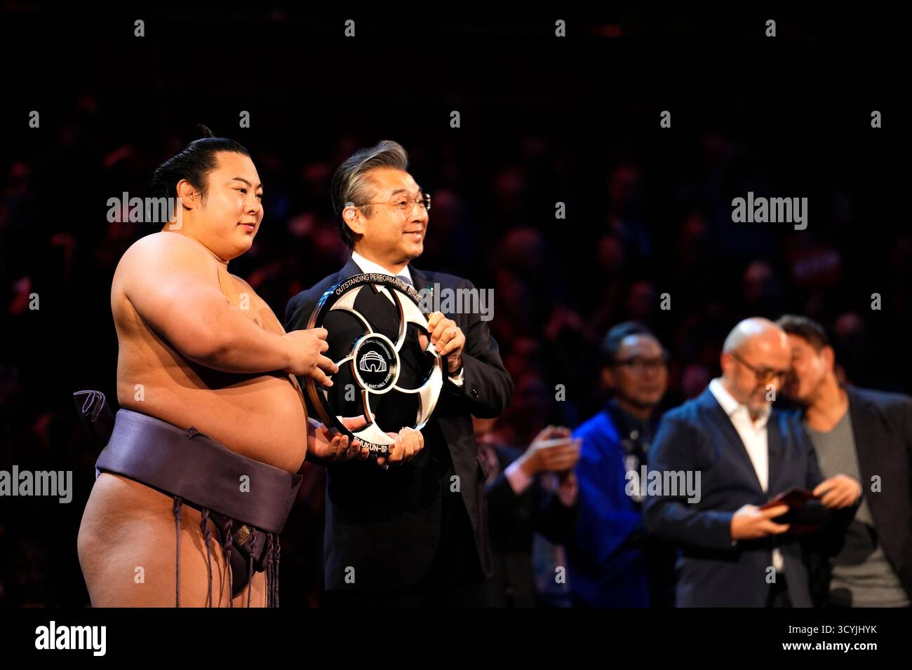 Tobizaru is presented with the Outstanding Performance prize by Hiroshi Suzuki on day five of ...