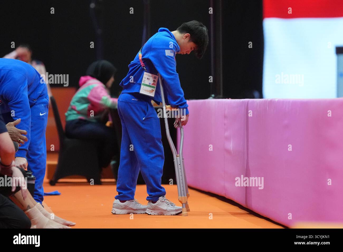 Asher Hong of the US stands with crutches during the 53rd Artistic ...