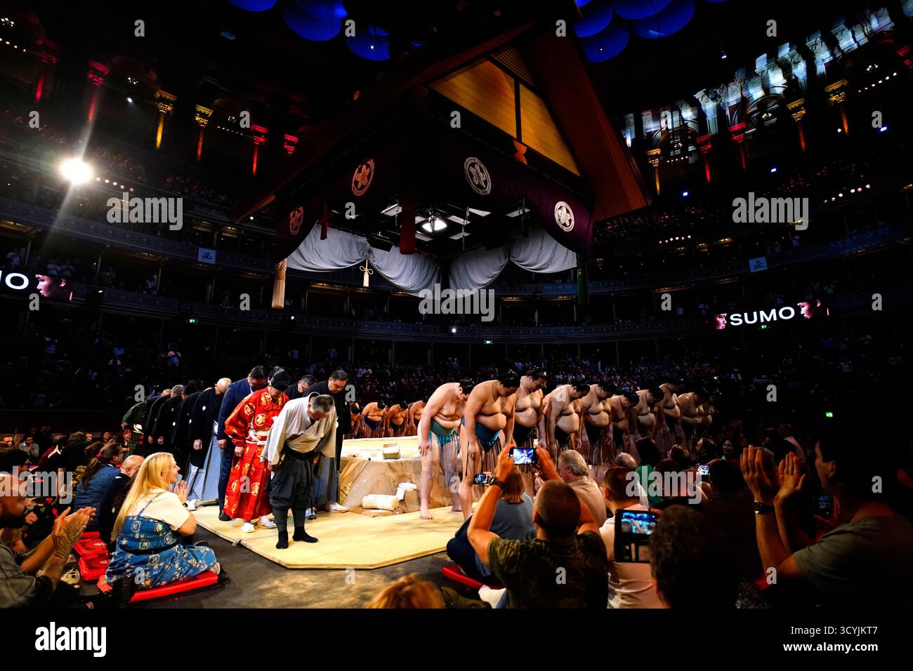 Rikishi bow to spectators in the closing ceremony following on day five of the Grand Sumo ...