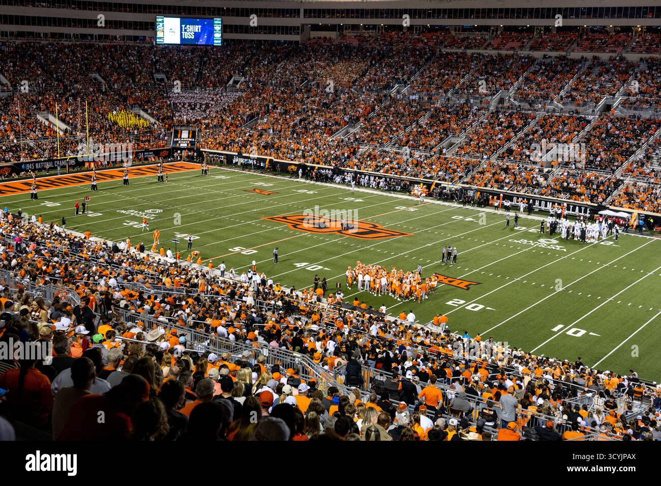 Fans in the stands of Oklahoma State's Boone Pickens Stadium in the ...