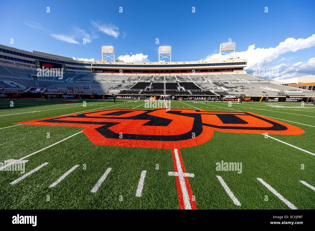 The Oklahoma State logo at the center of the field before an NCAA ...