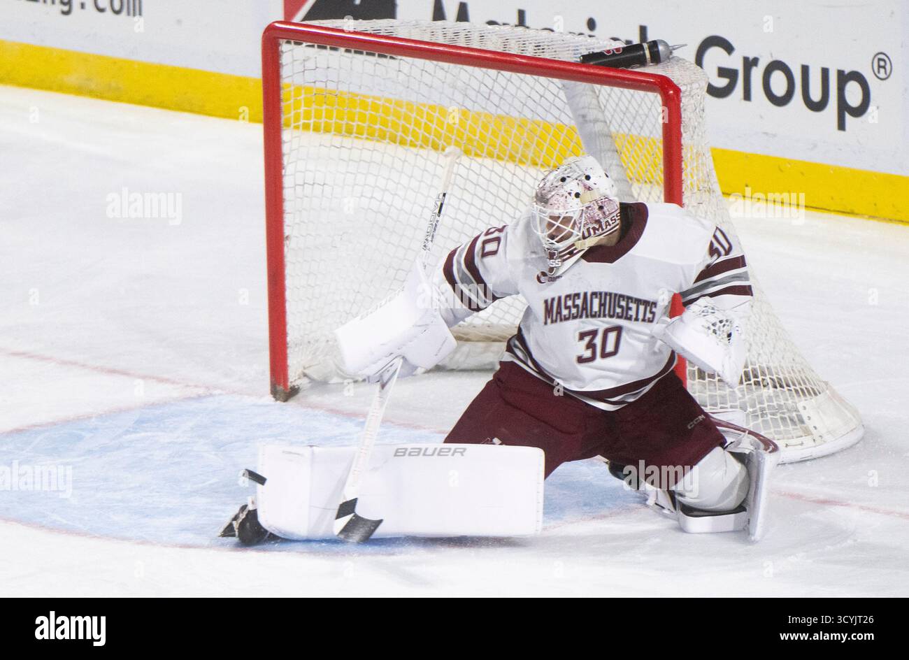 UMass goalie Michael Hrabal blocks a shot during the NCAA college ...